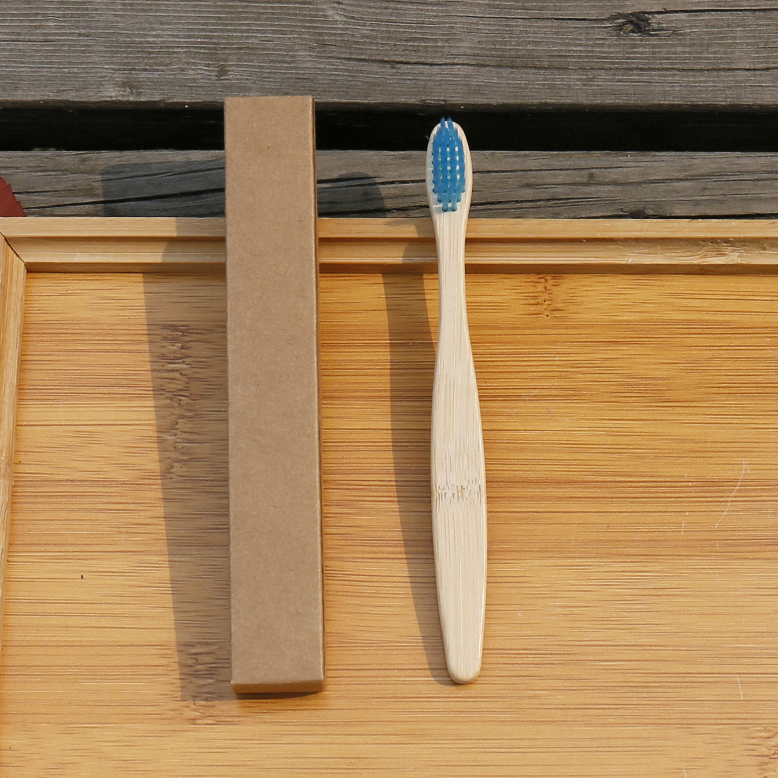 Colored soft wood toothbrush